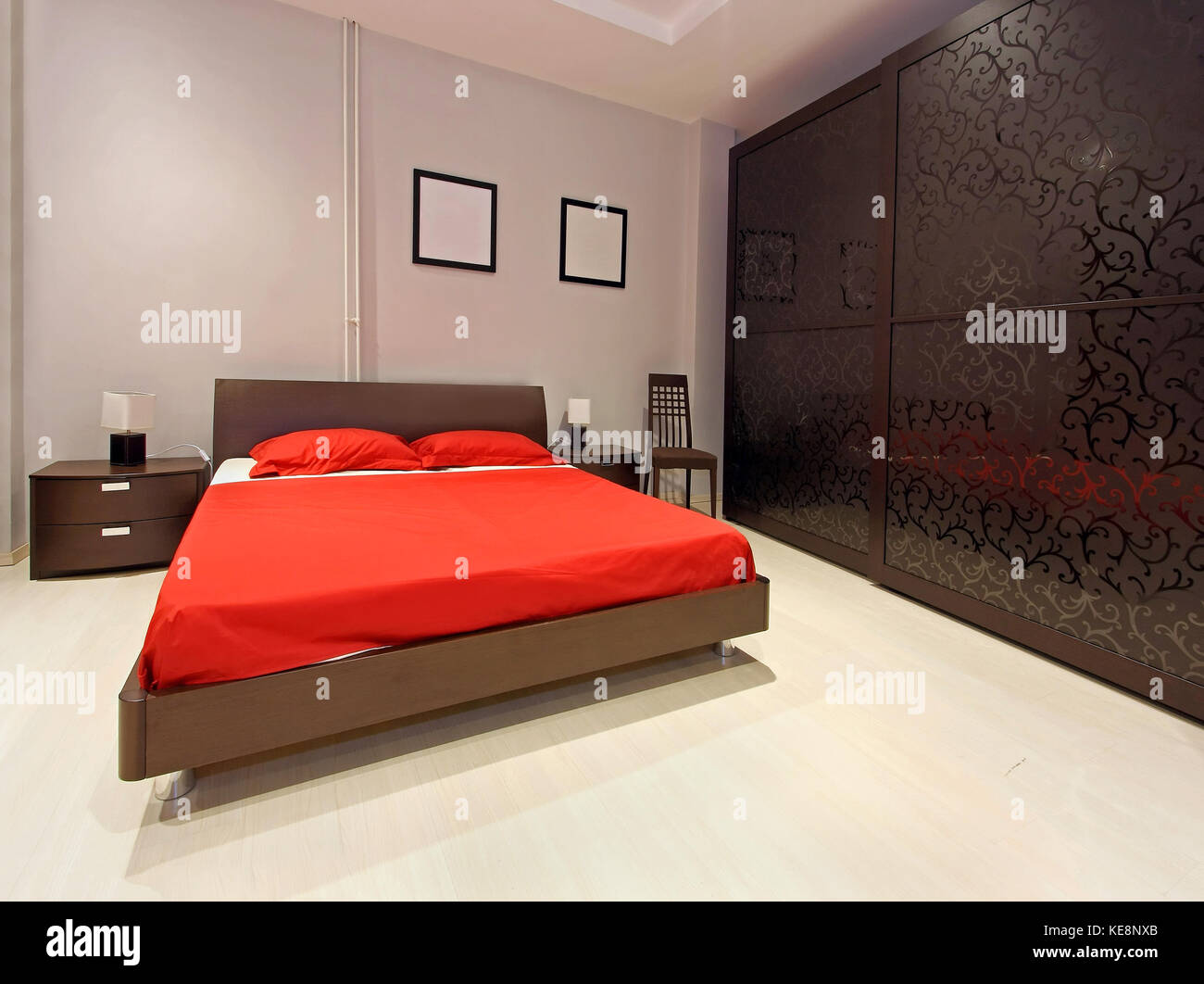 Modern bedroom interior with large double bed Stock Photo - Alamy