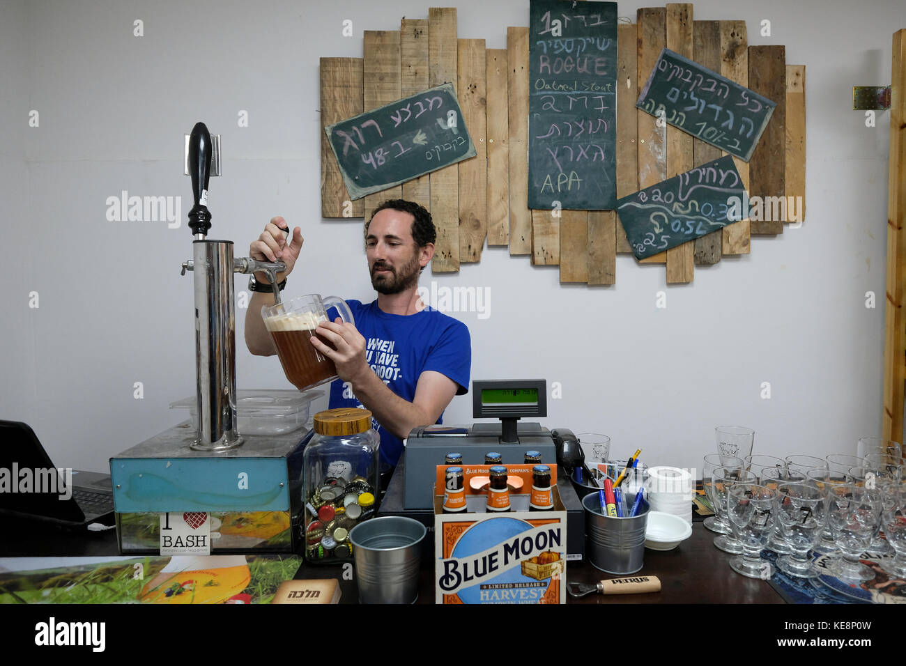 Gilad Ne-Eman a young Israeli brewer pouring beer of an Israeli private ...
