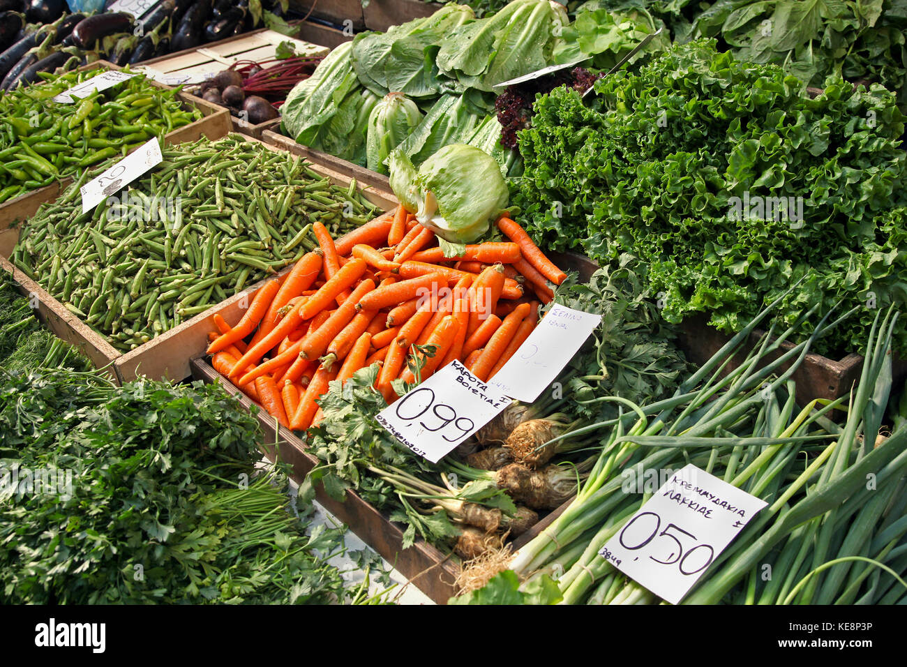 Organic green vegetables sold on market stall Stock Photo - Alamy