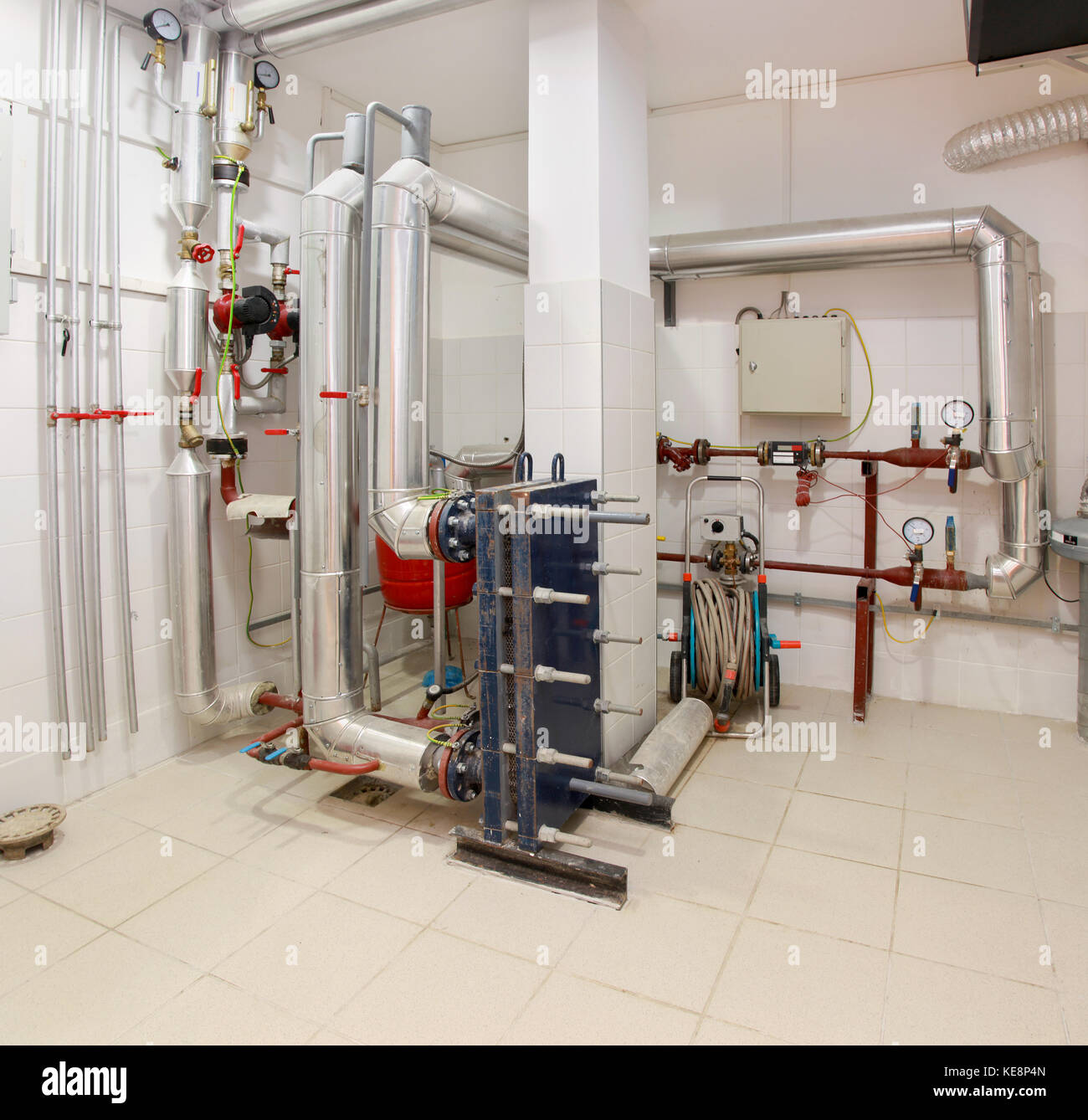 Utility room in house basement withboilers and pipes Stock Photo - Alamy