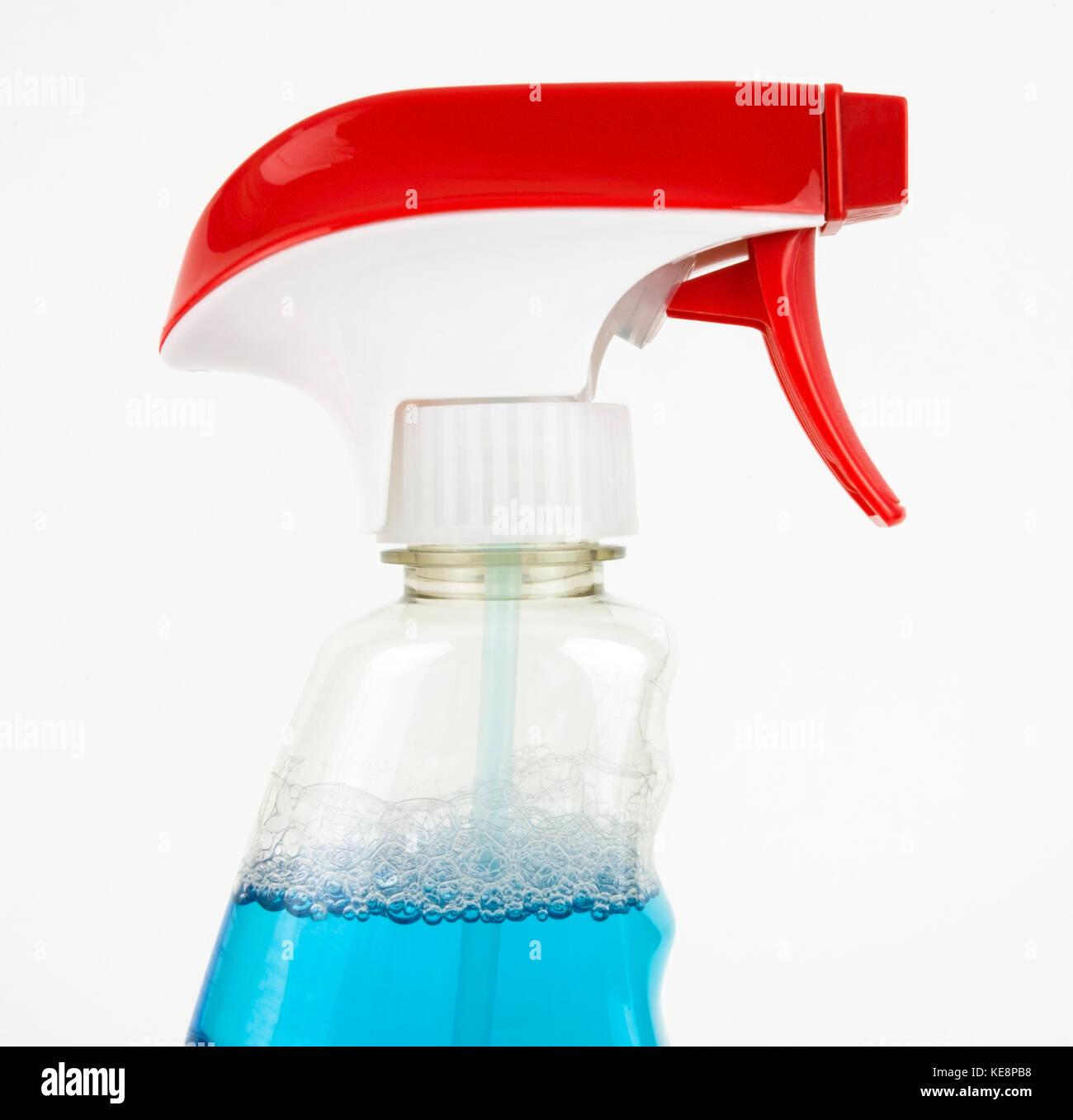 Red spray bottle trigger Stock Photo - Alamy