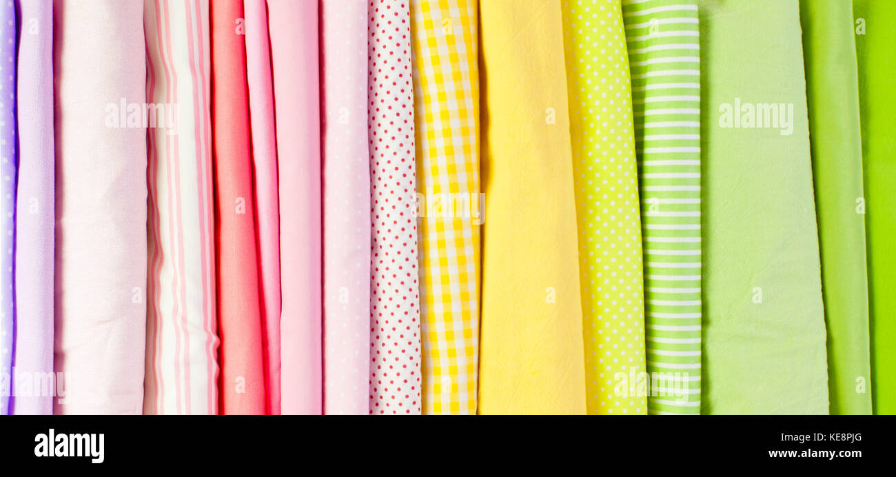 Cotton colored fabric. Background of white wood Stock Photo - Alamy