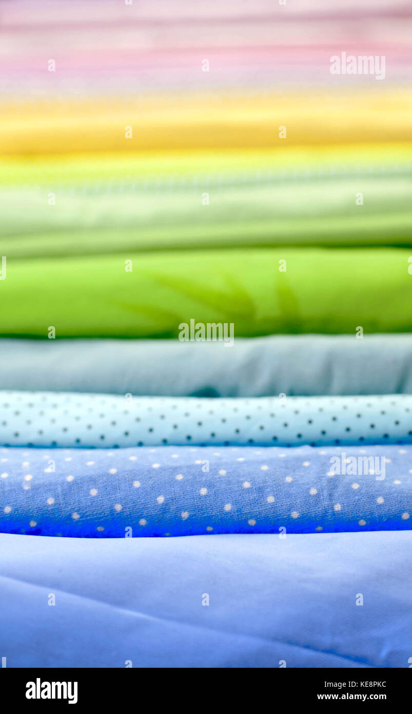 Cotton colored fabric. Background of white wood Stock Photo - Alamy