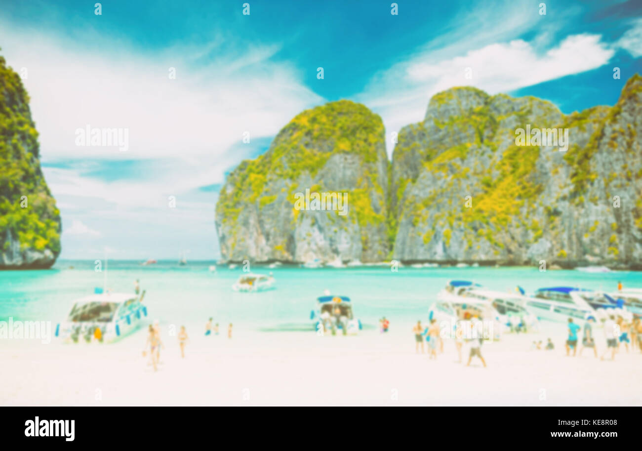 blurred tourist on white sand beach at maya bay, phi phi leh island, thailand - vintage tone ...