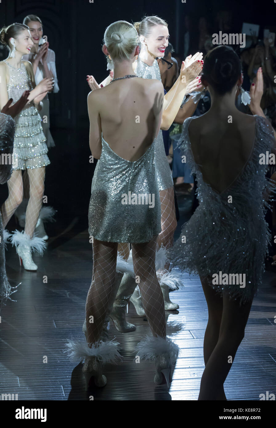 NEW YORK, NY - October 6, 2017: Models dance on the runway wearing ...