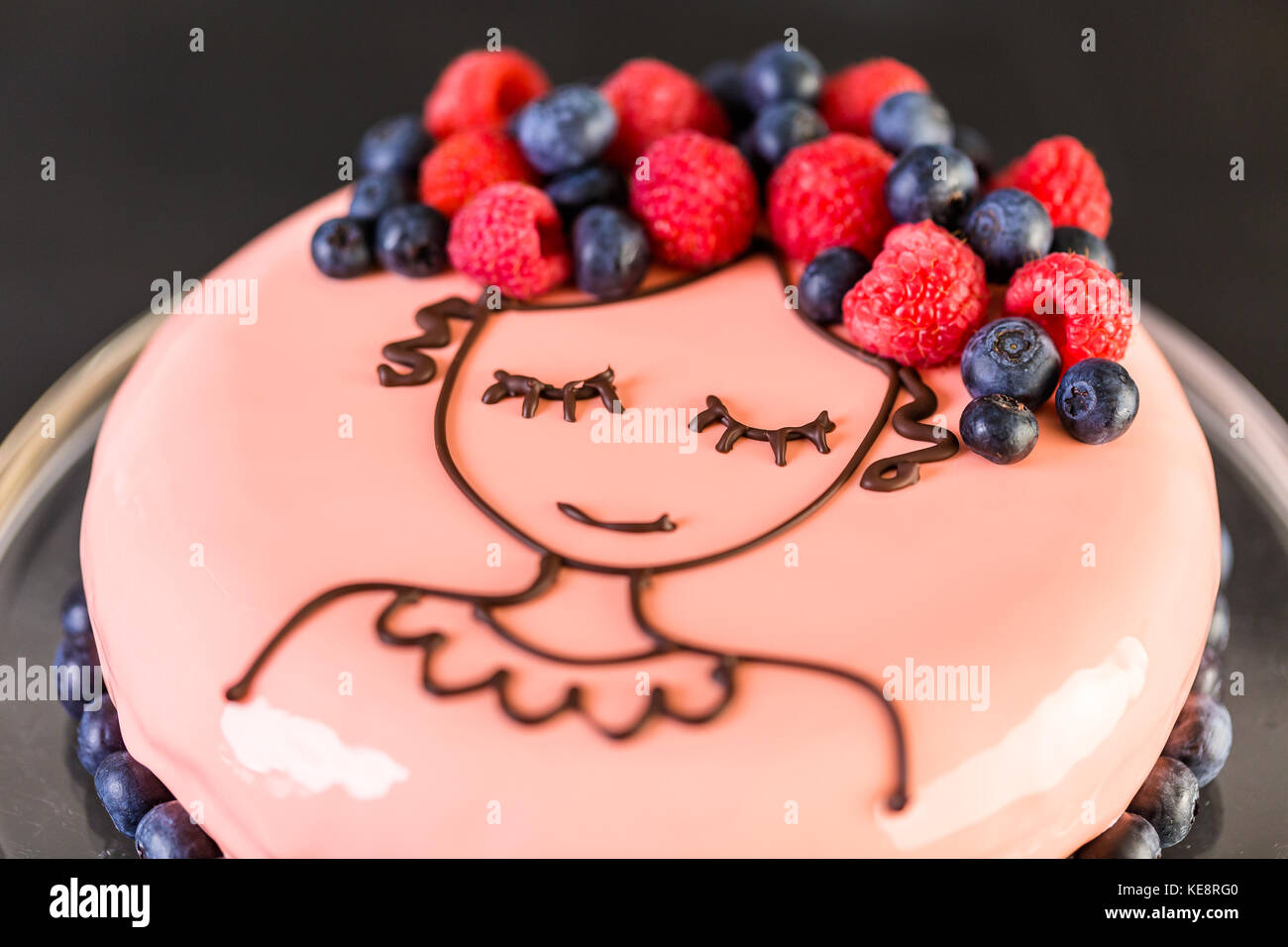 Mousse cake with pink mirror glaze and fresh berries Stock Photo - Alamy