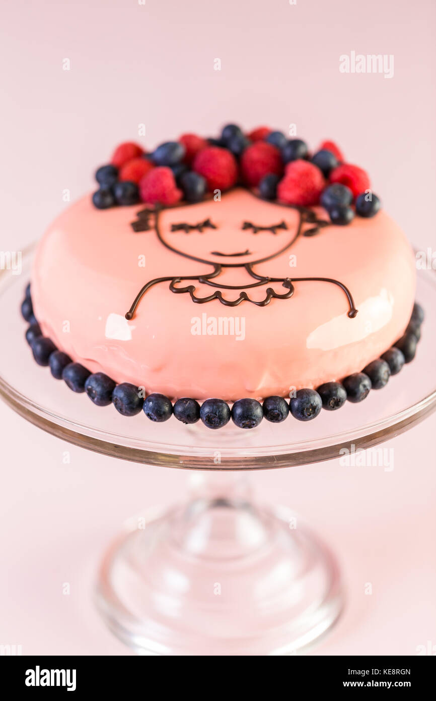 Mousse cake with pink mirror glaze and fresh berries Stock Photo - Alamy