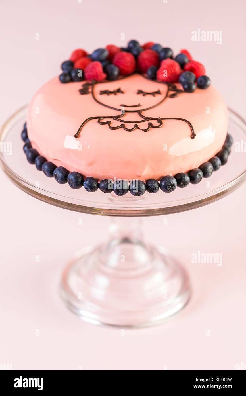 Mousse cake with pink mirror glaze and fresh berries Stock Photo - Alamy