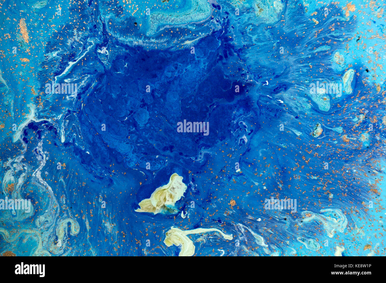 Marbled blue abstract background with golden sequins. Liquid marble ink ...