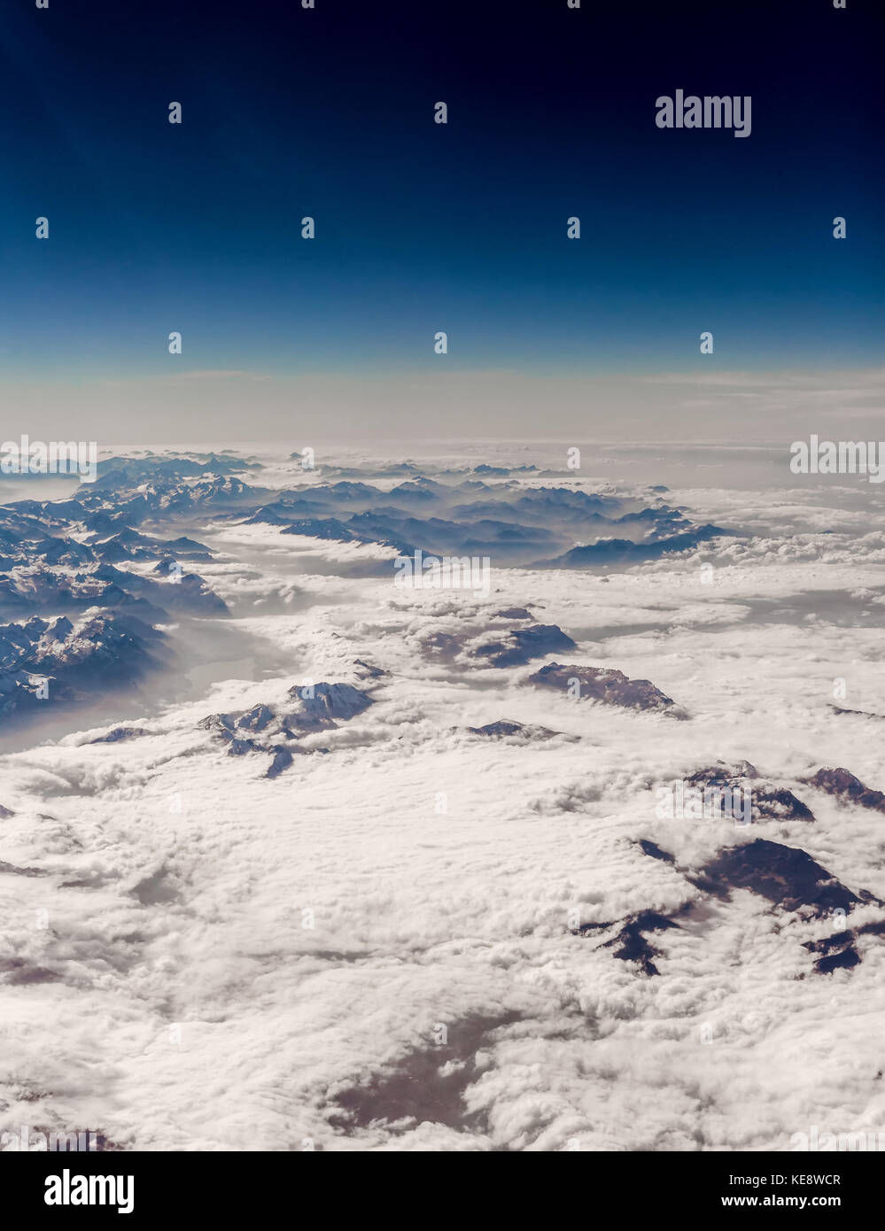 Aerial shot of the Alps taken from an altitude of 40,000ft Stock Photo ...