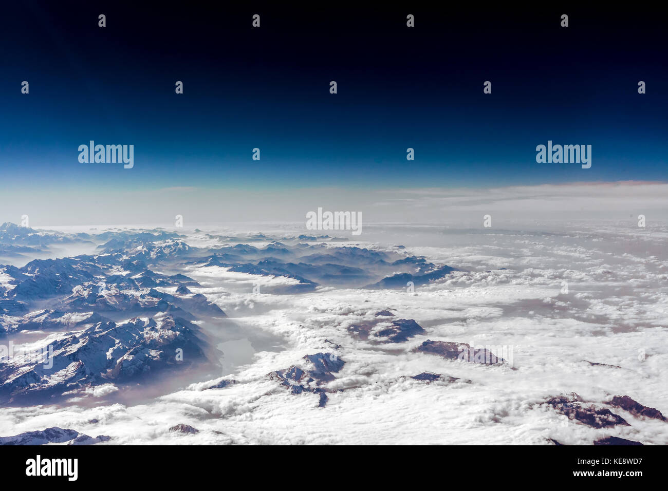 Aerial shot of the Alps taken from an altitude of 40,000ft Stock Photo ...