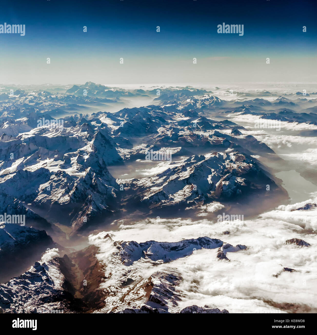 Aerial shot of the Alps taken from an altitude of 40,000ft Stock Photo ...