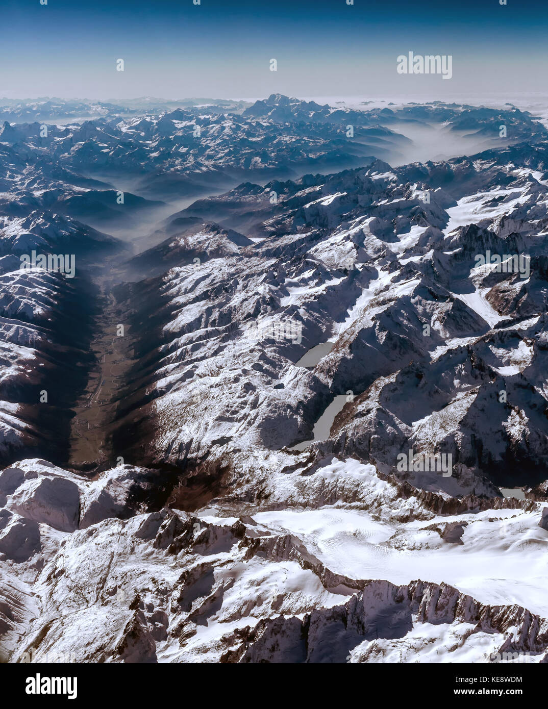Aerial shot of the Alps taken from an altitude of 40,000ft Stock Photo ...