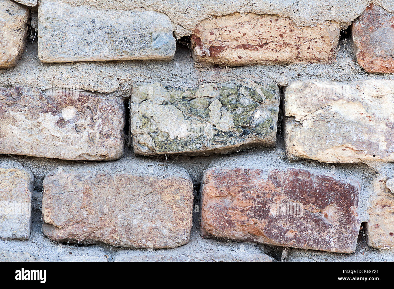 Brick wall. Broken plaster. Cracked and corroded cement Stock Photo - Alamy