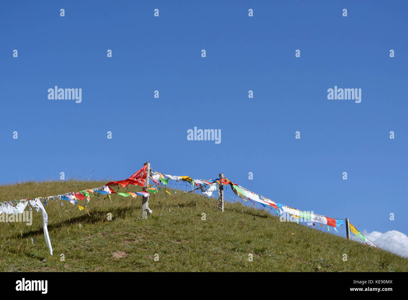 The prayer flags around the mountain behind Labrang or Xiahe, in Amdo ...