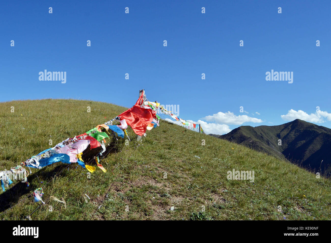 The prayer flags around the mountain behind Labrang or Xiahe, in Amdo ...