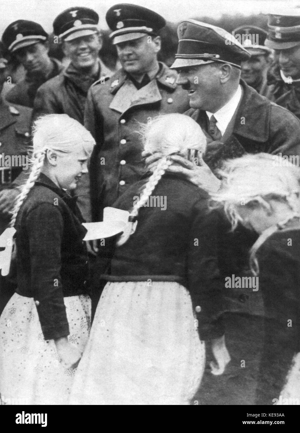 Imperial Chancellor and National Socialist leader Adolf Hitler hugs a ...
