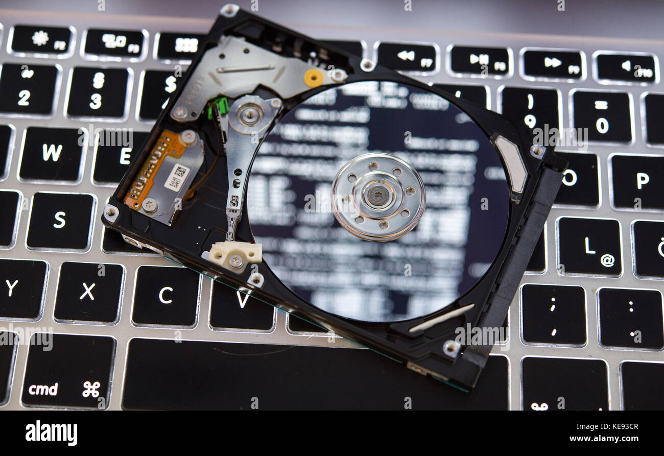 Illustration - open harddrive placed on laptop keyboard, Norden, Lower ...