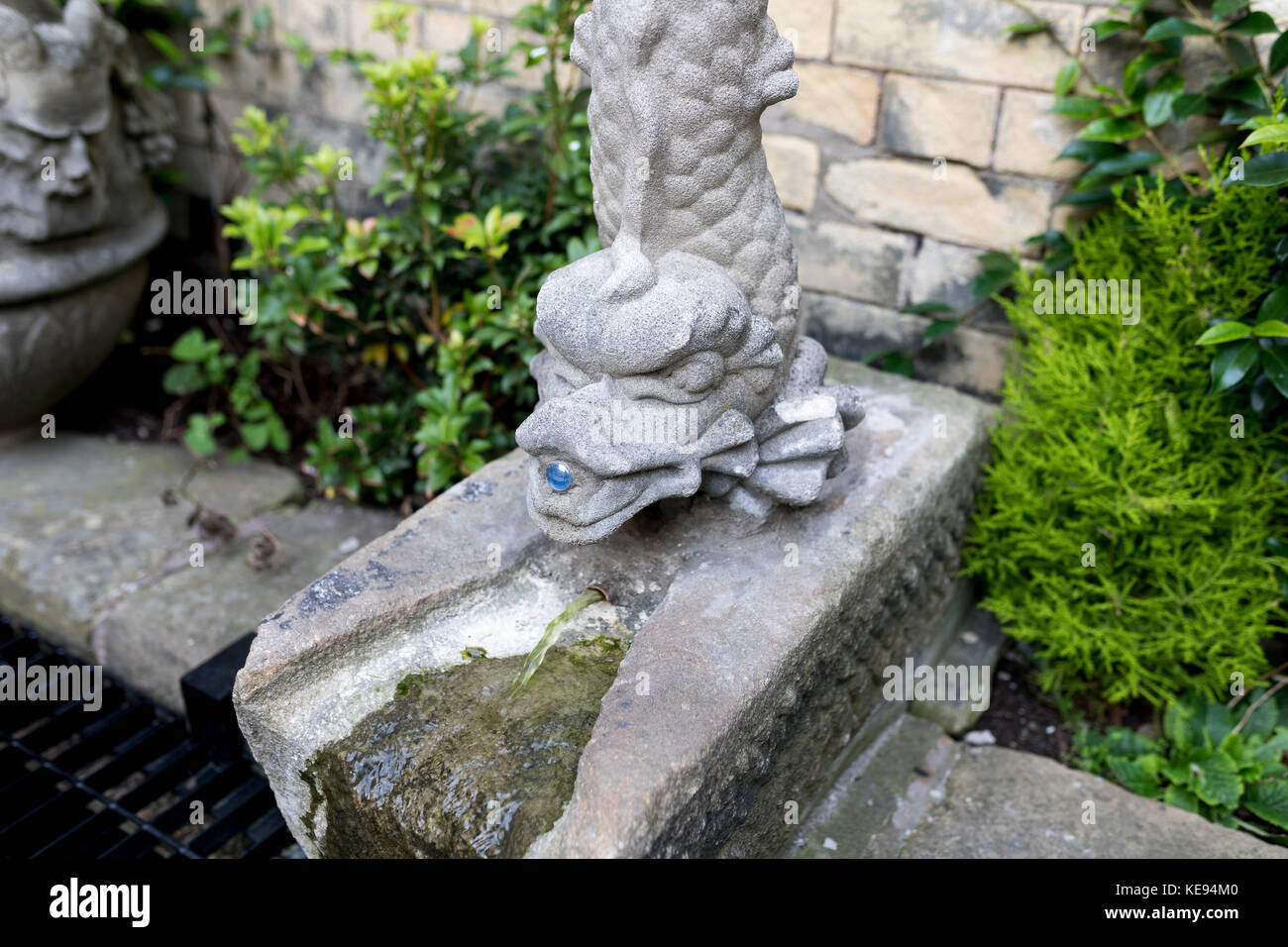 Concrete chinese dragon or fish staute water fountain feature with ...