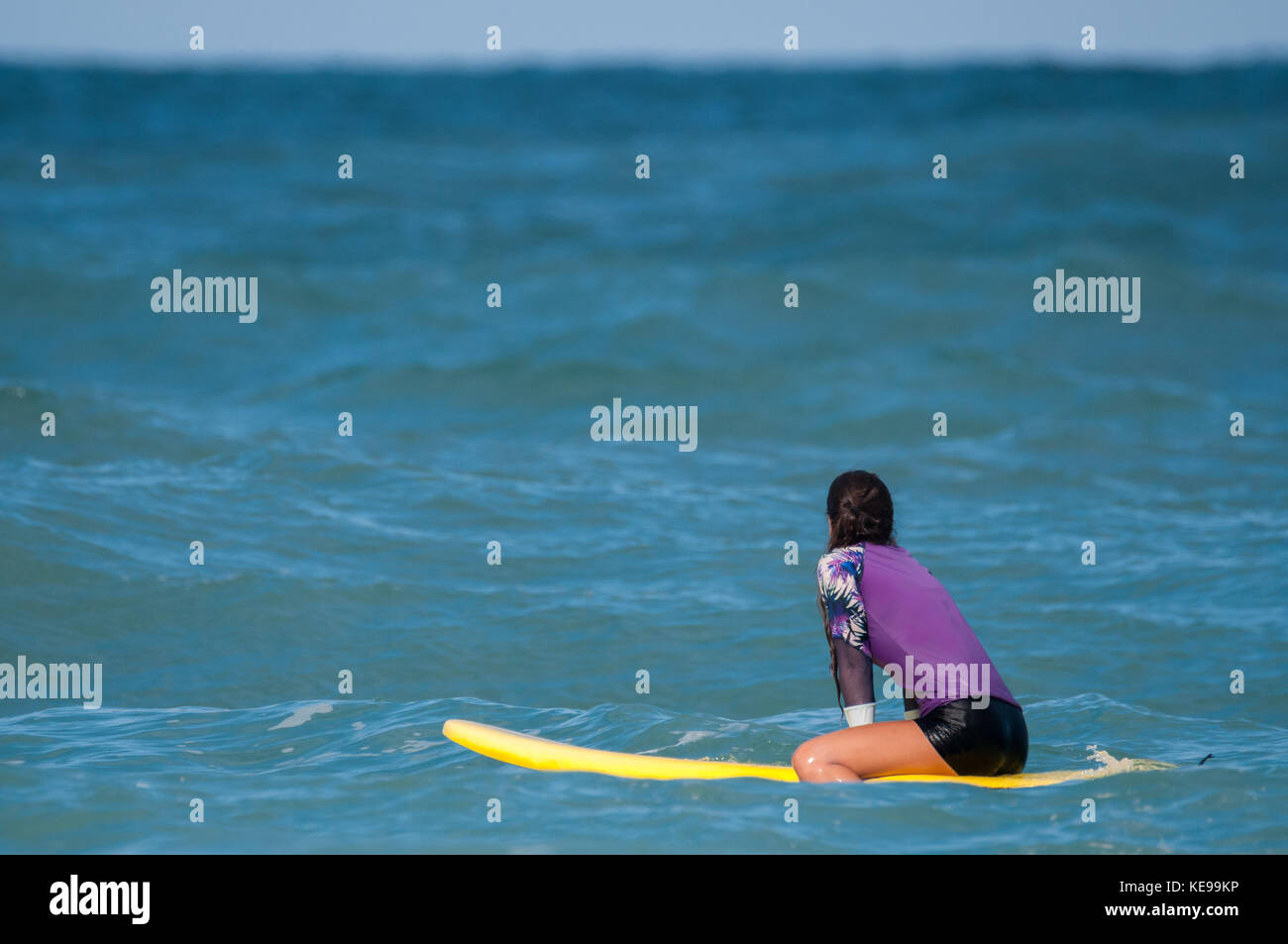 Single female surfer close up on the open sea Stock Photo - Alamy