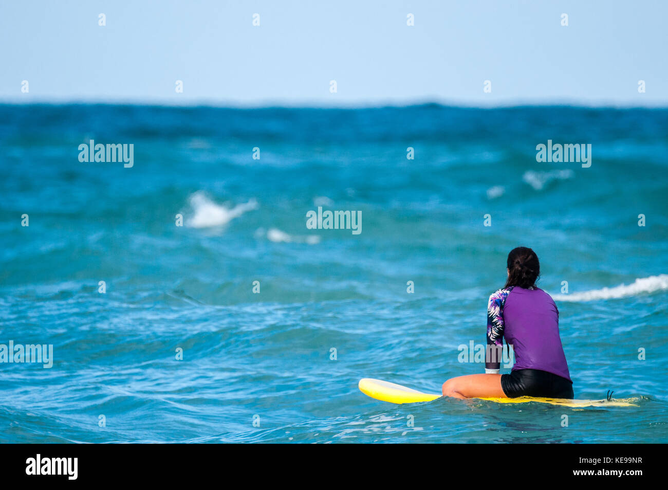 Single female surfer close up on the open sea Stock Photo - Alamy