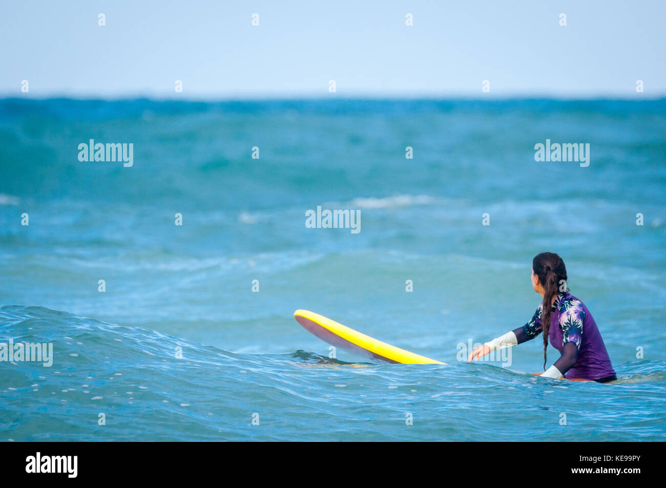 Single female surfer close up on the open sea Stock Photo - Alamy