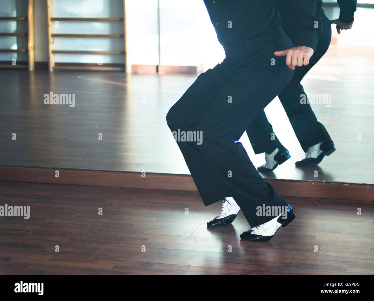 Ballroom dance male dancer and teacher in studio school dancing in ...