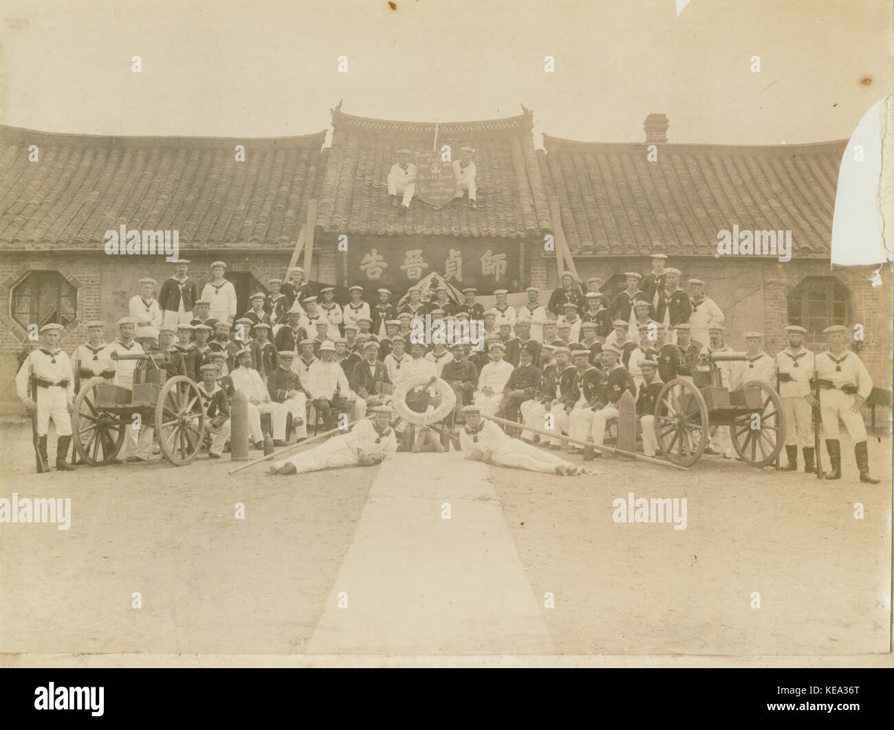 This image depicts a scene from Tsingtau, China, between 1900 and 1903 ...