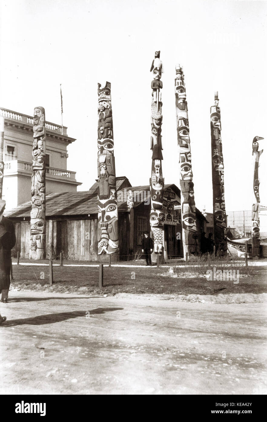 Totem poles in front of the Alaska State Building at the 1904 World's ...