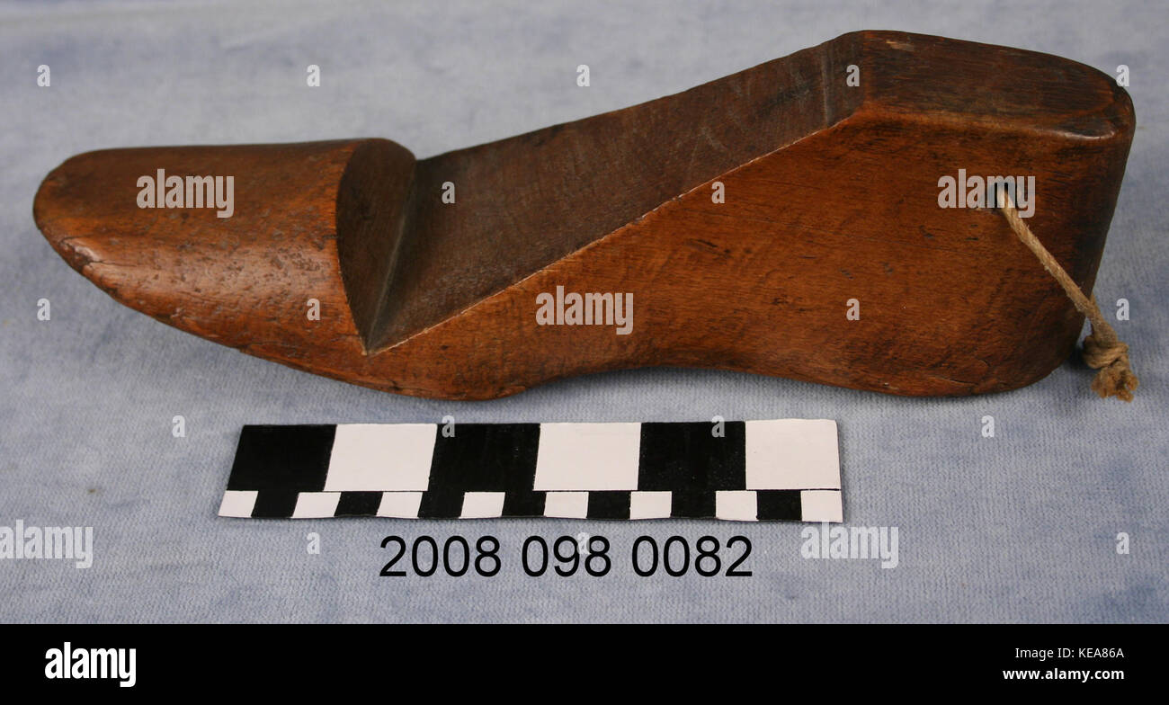 A photo of a wooden shoe last, a tool used in shoemaking to shape and ...