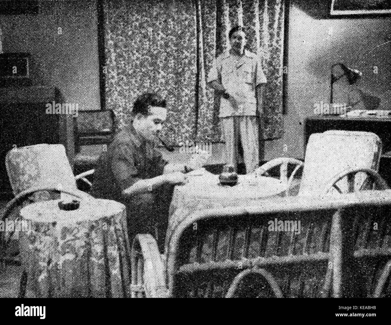 Agus giving instructions to Mochtar, Inspektur Rachman, p10 Stock Photo ...