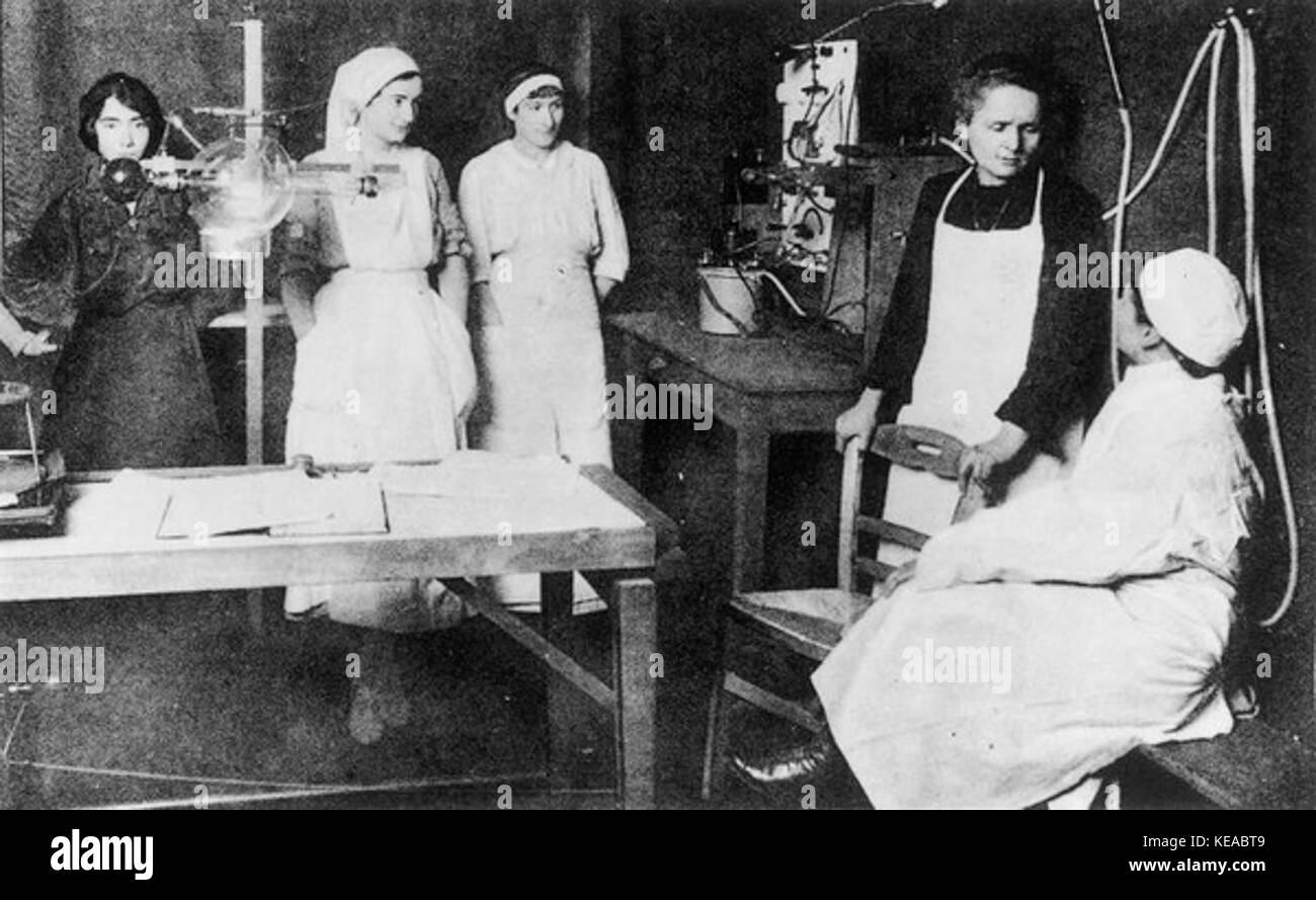 Marie Curie is pictured alongside nurses and a physician, emphasizing ...