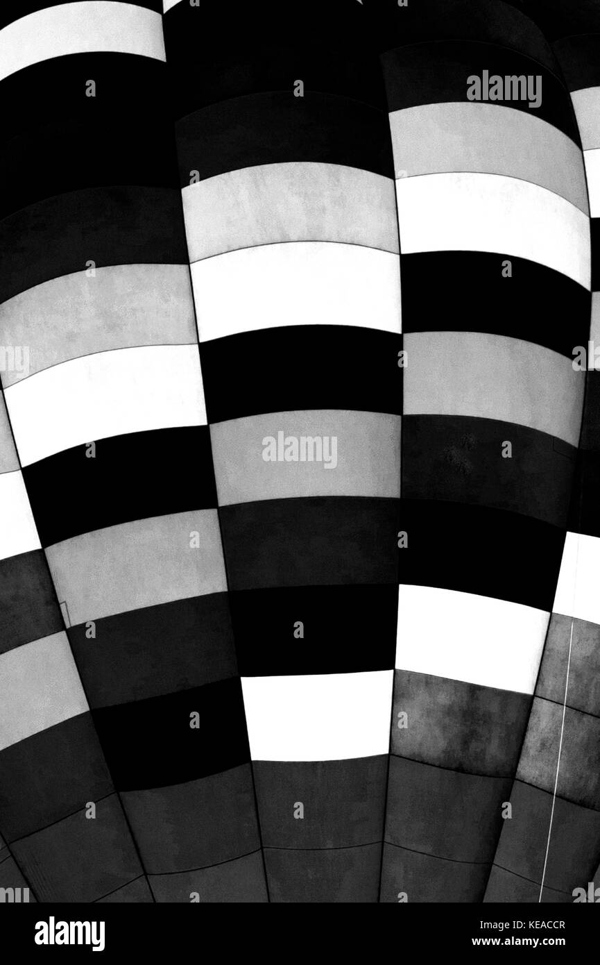 Hot Air balloon lifting off from field at sunrise Stock Photo - Alamy