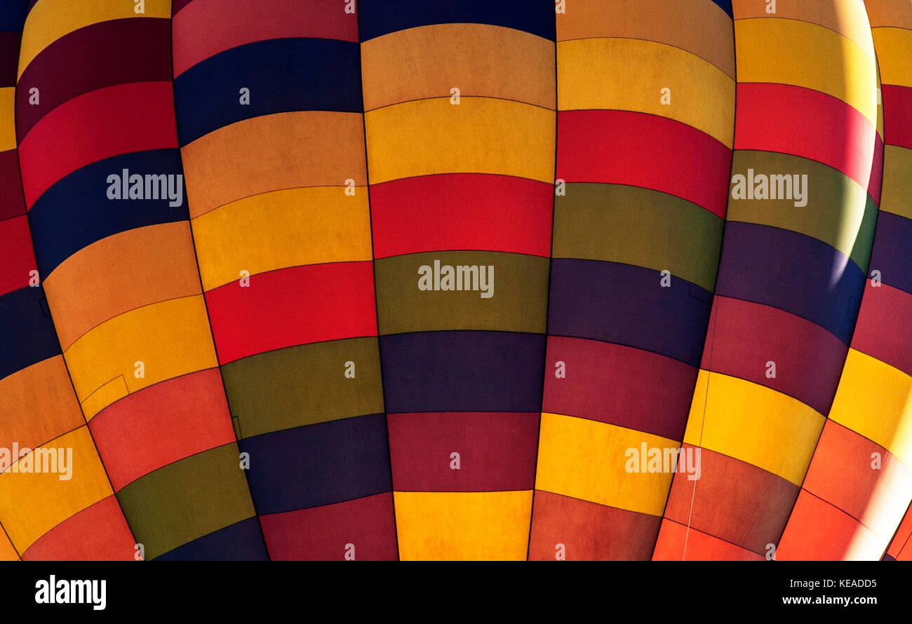 Hot Air balloon lifting off from field at sunrise Stock Photo - Alamy