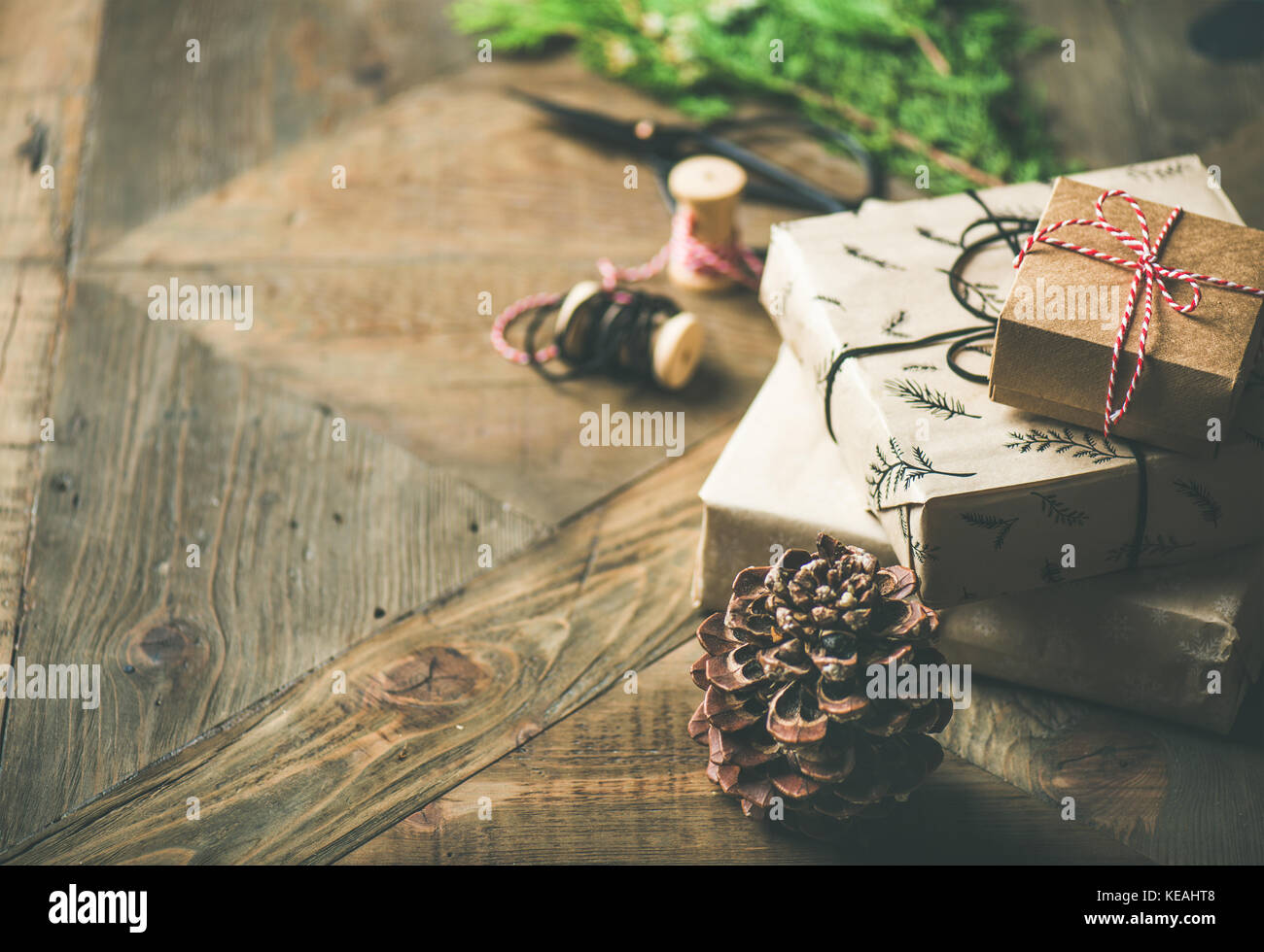 Gift boxes, rope, fur branches, scissors, copy space Stock Photo - Alamy