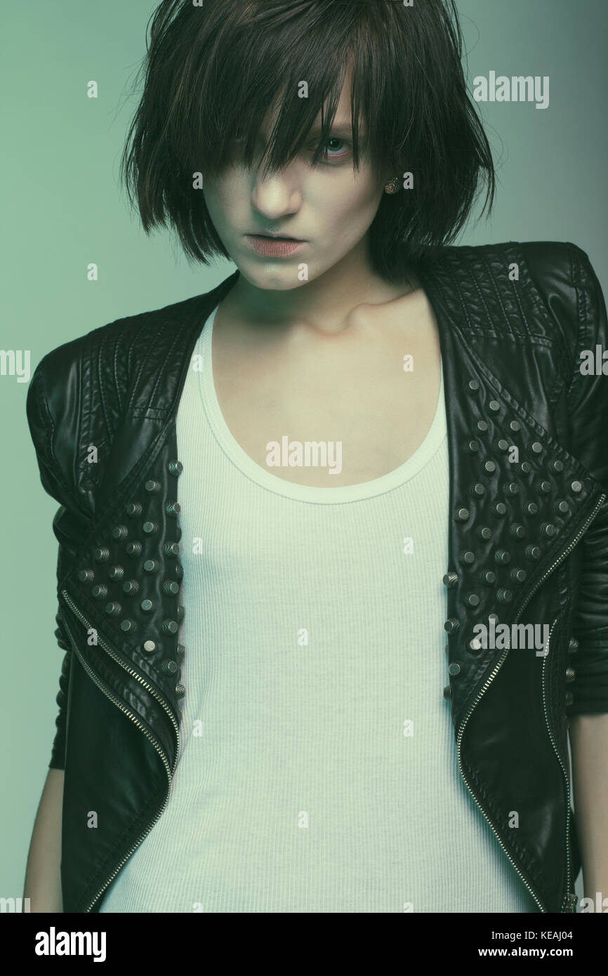Androgyny female model in Heroin chic style. Old style tinted image ...