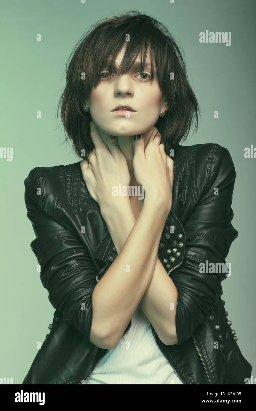 Androgyny female model in Heroin chic style. Old style tinted image ...