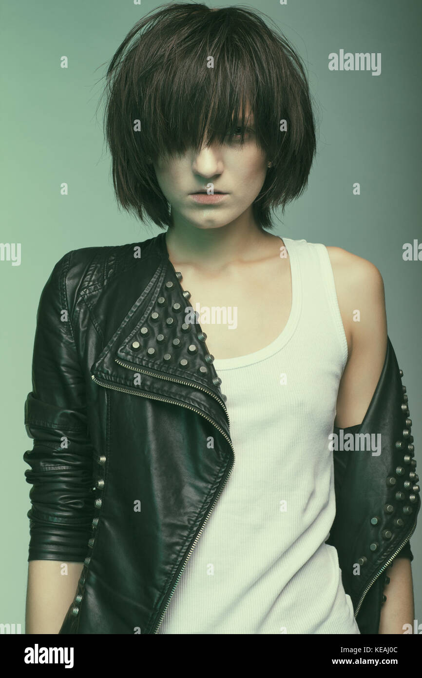 Androgyny female model in Heroin chic style. Old style tinted image ...