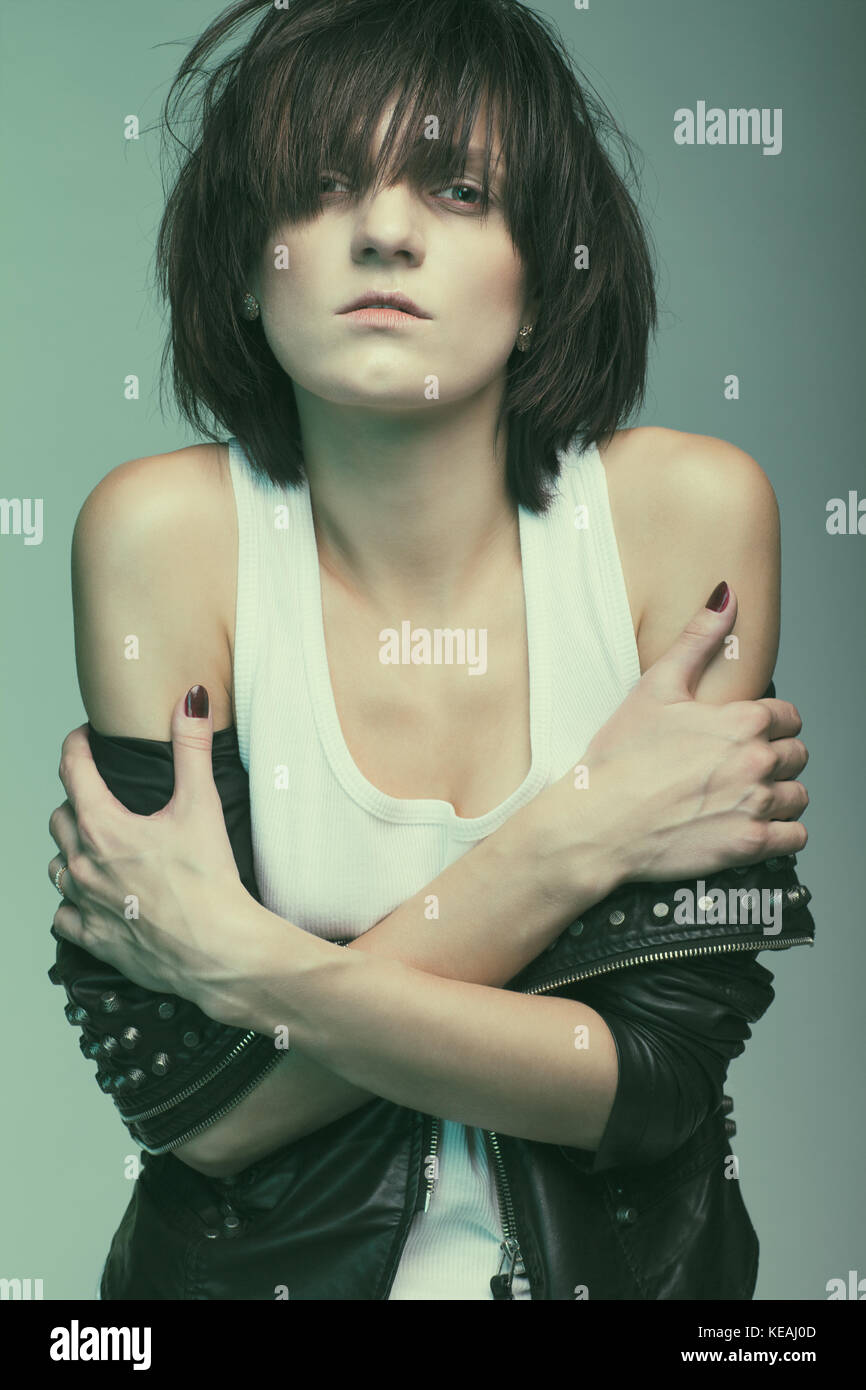 Androgyny female model in Heroin chic style. Old style tinted image ...