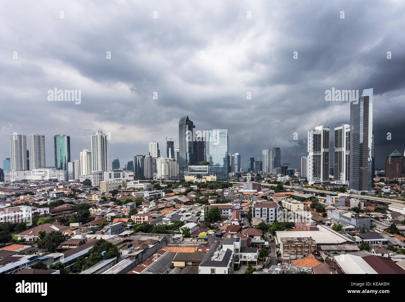 Threatening sky before a tropical storm over the business district of ...