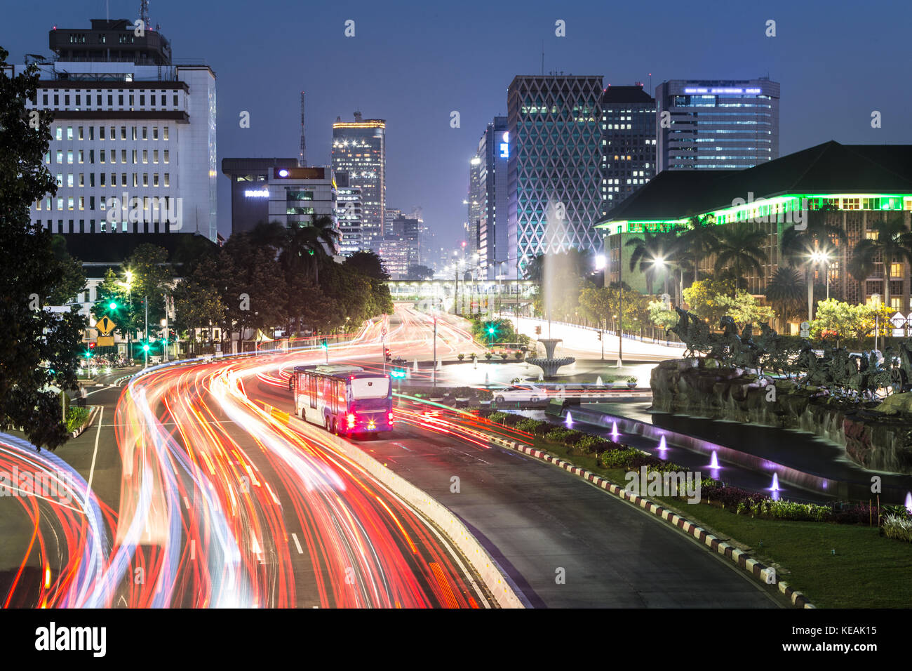 Traffic light trails along Jakarta main avenue in the business district ...