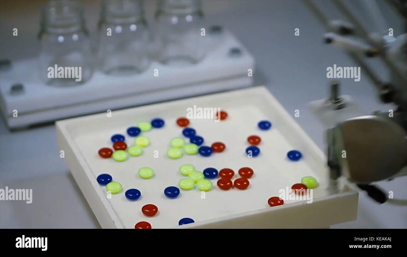 Automatic robot pharmaceutical industry. Robot automatically sorting ...