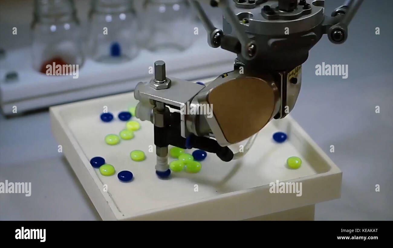 Automatic robot pharmaceutical industry. Robot automatically sorting ...