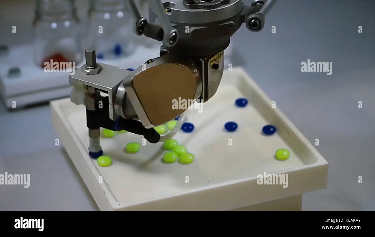 Automatic robot pharmaceutical industry. Robot automatically sorting ...