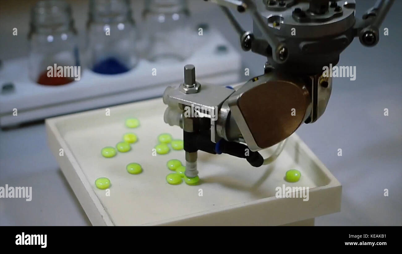 Automatic robot pharmaceutical industry. Robot automatically sorting ...
