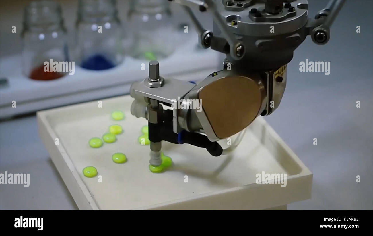 Automatic robot pharmaceutical industry. Robot automatically sorting ...