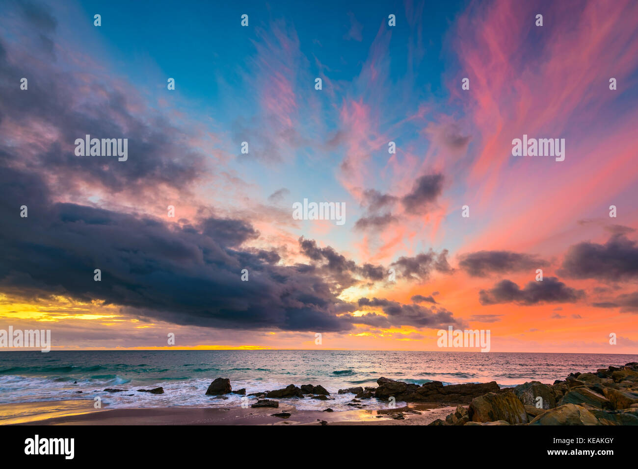Dramatic sunset over rocky beach, South Australia Stock Photo - Alamy