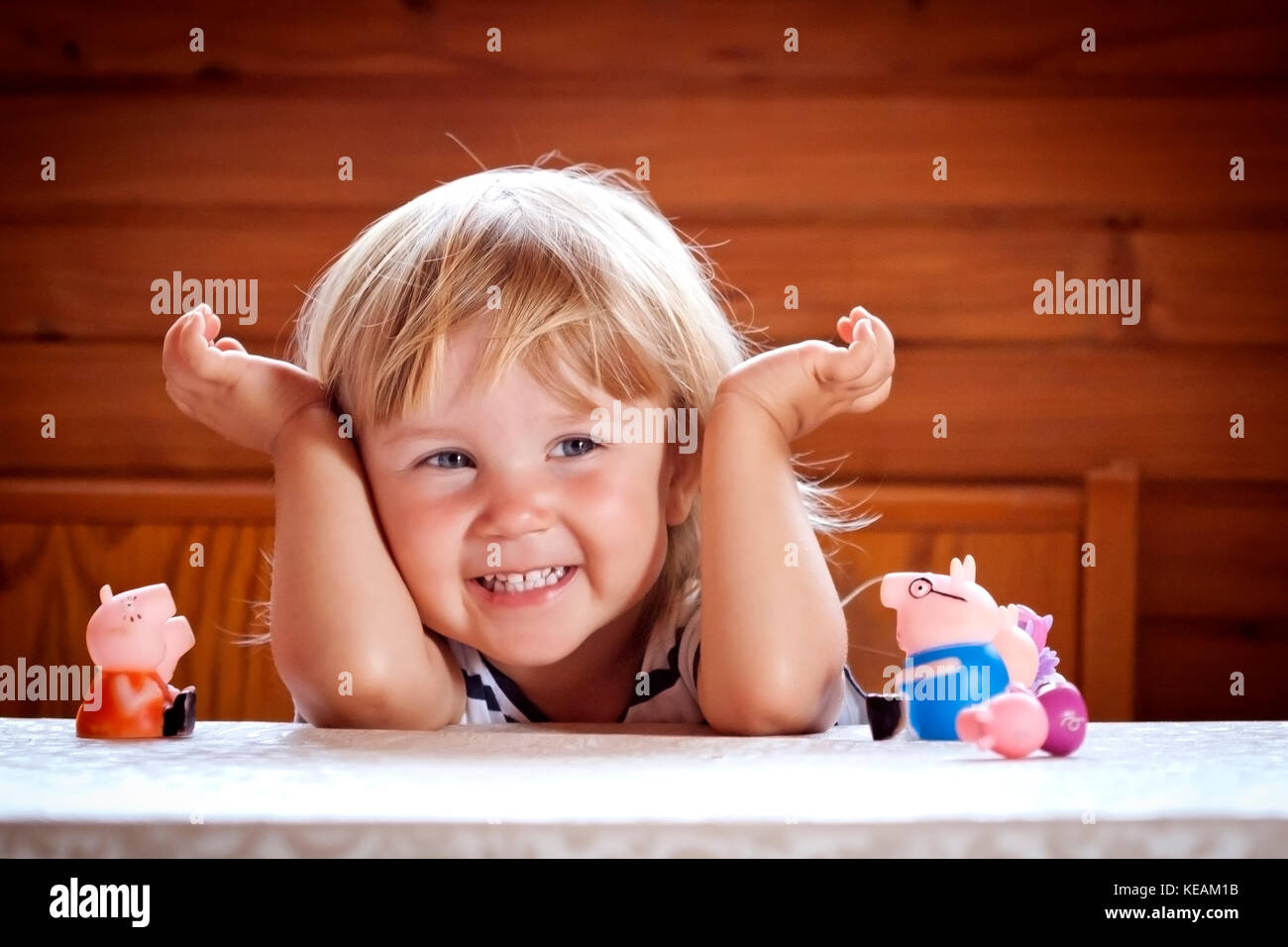 Little young girl with her toys having fun with her toys Stock Photo ...