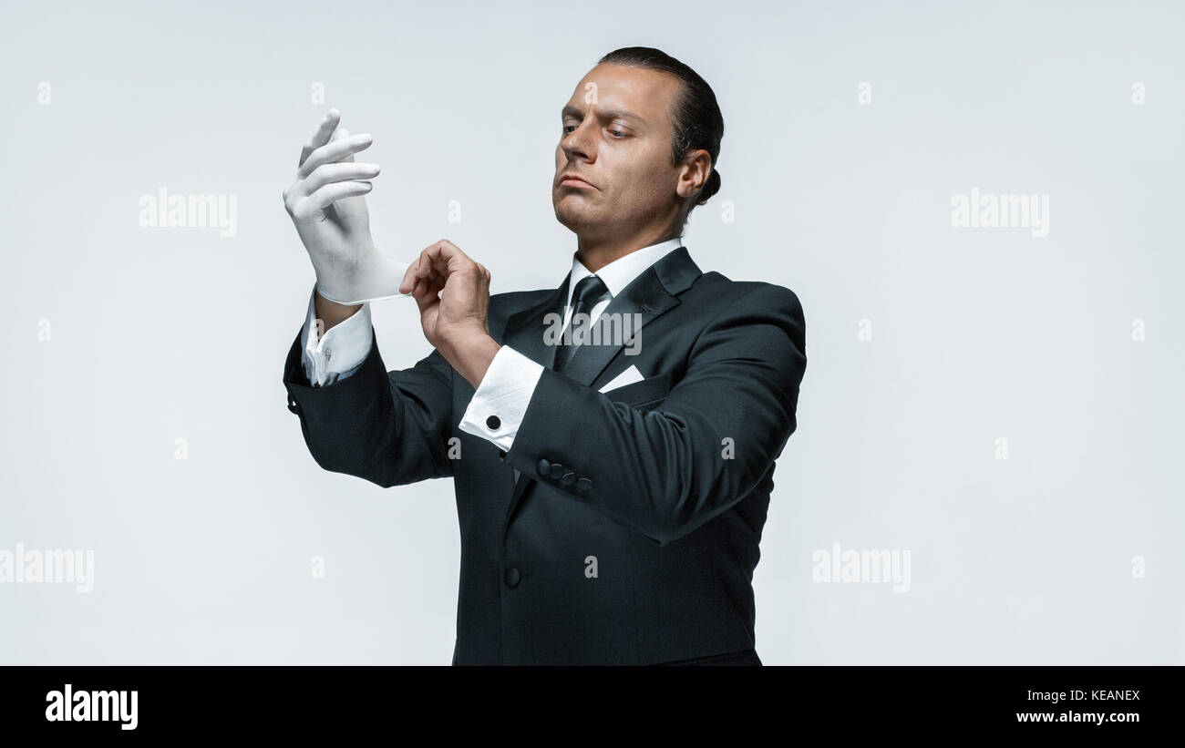 At Your service, well dressed man waiting for orders isolated on white ...