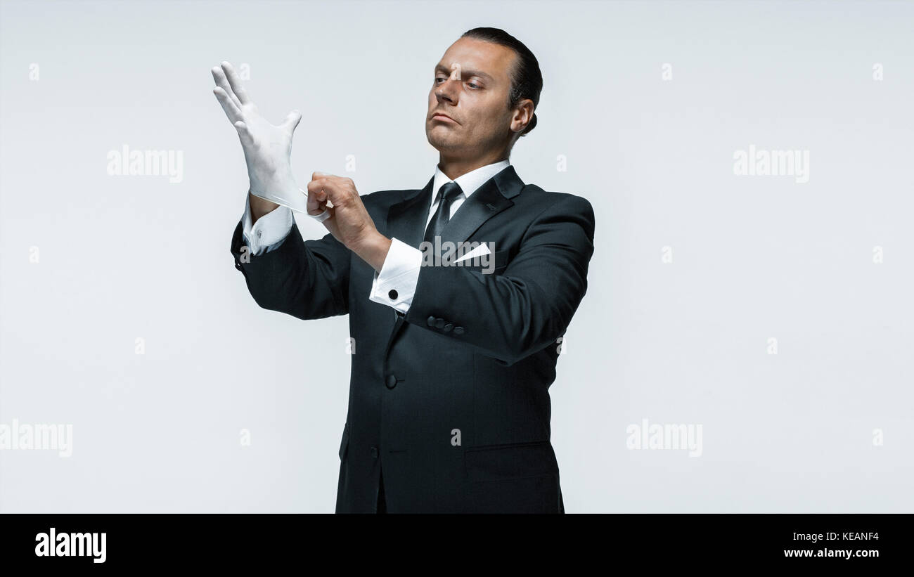 At Your service, well dressed man waiting for orders isolated on white ...